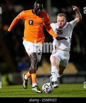 Notts County's Alassana Jatta (left) reacts to AFC Wimbledon's Josh ...