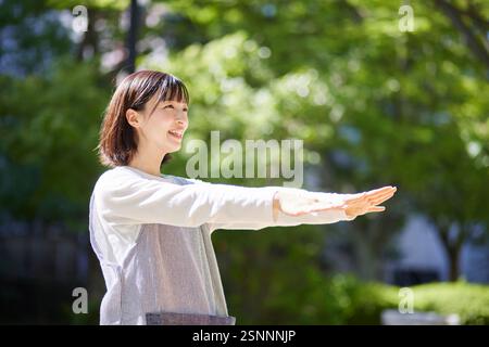 Smiling childcare worker woman Stock Photo - Alamy