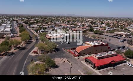 Apache Junction, Arizona, USA - June 1, 2022: Businesses stand in a ...
