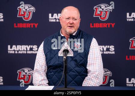 Head coach Carey Green of the Liberty Lady Flames looks on during a ...