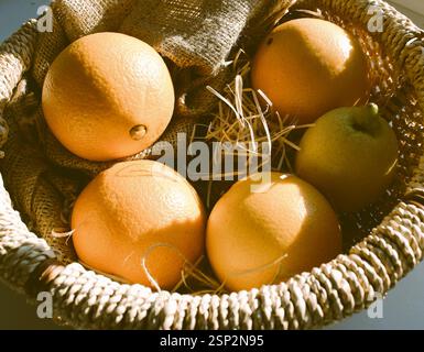 Fresh orange fruits in a burlap bag on white background Stock Photo - Alamy