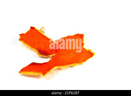 Dried tangerine peel against a white background Stock Photo - Alamy