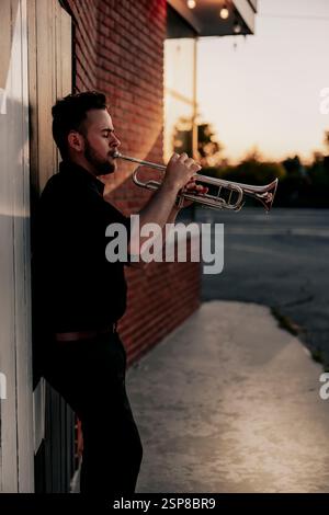 Confident trumpet player at golden hour with a sophisticated look Stock ...