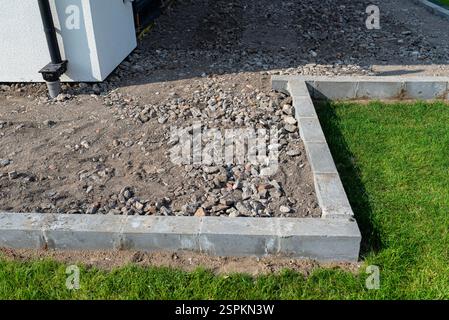 Compacting rubble on a terrace under construction using a gasoline ...
