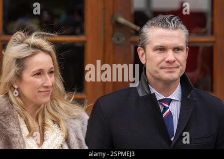 Defense Secretary Pete Hegseth is seen on the sidelines before an NFL ...