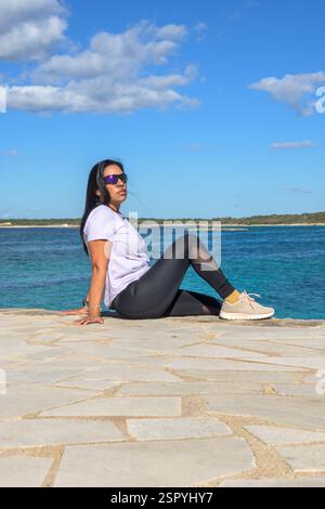 Latina Woman Relaxing on a Pier in Mallorca, Spain Stock Photo - Alamy