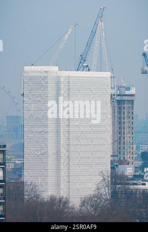 Maydew House in Bermondsey is wrapped in white sheeting ready for ...