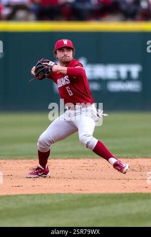 February 14, 2025: Cougars infielder Ollie Obenour (8) settles in front ...