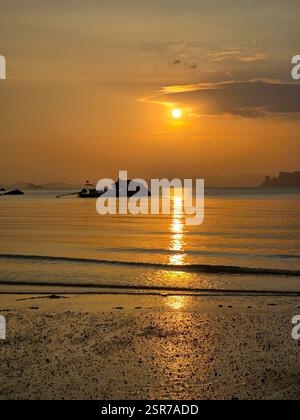 The evening sun sets in the Andaman Sea and creates a sunny path ...