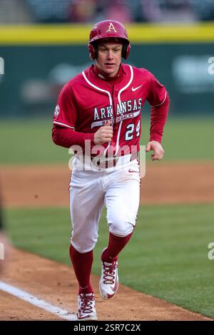 February 14, 2025: Charles Davalan (24) of Arkansas raises his right ...