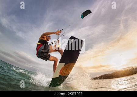 A closeup of a man jumping over a water in Salinas Grandes, Argentina ...