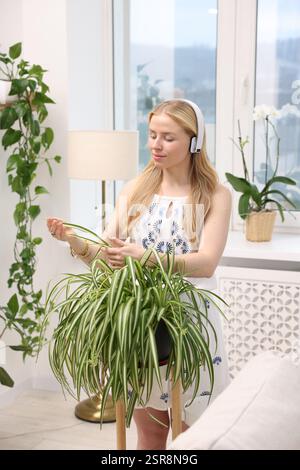 Young Japanese woman listening to music with headphones Stock Photo - Alamy