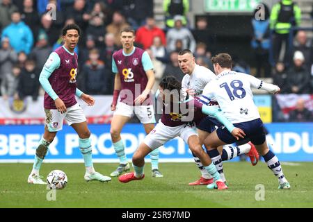 Burnley's Hannibal Mejbri (centre) and Preston North End's Stefan ...