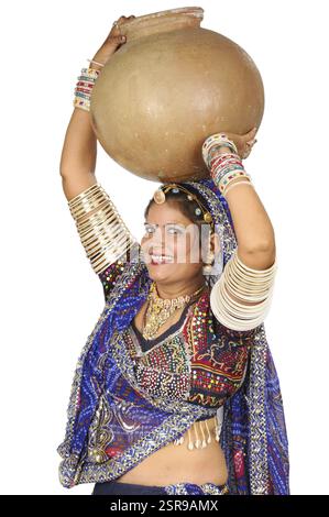 Rajasthani lady carrying earthen pitcher on head MR#786 Stock Photo - Alamy
