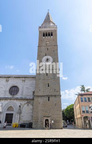 Koper, Slovenia - August 30, 2024: Tourist passing Praetorian Palace at ...