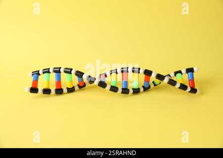 One DNA structure model on color background Stock Photo - Alamy