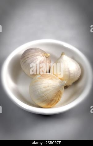Small bowls with spices on gray background Stock Photo - Alamy