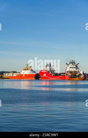Offshore supply vessels and anchor handling tug ships anchored at open ...