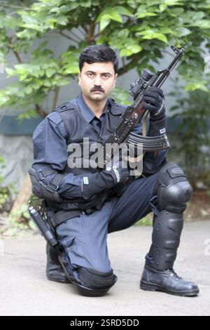 Black Cat commando with an AK 47 light machine gun MR#725 Stock Photo ...