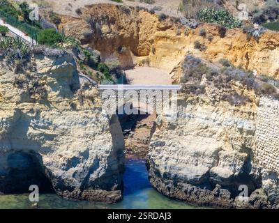 Algarve cliffs with Pinhao Fort Bridge as seen from the Atlantic Ocean ...