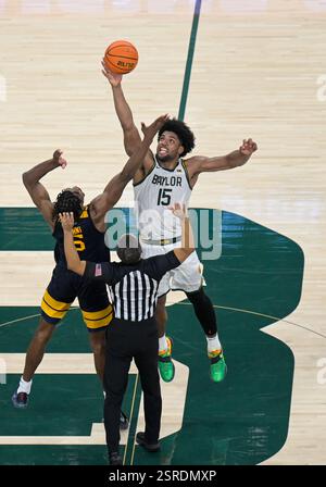 West Virginia guard Toby Okani (5) shoots the basketball over BYU guard ...