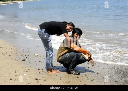 Man and woman enjoying at Rangat, Middle Andaman Islands, Bay of Bengal ...