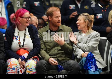 Clare Price (left) and the Duke of Sussex watching the sitting ...