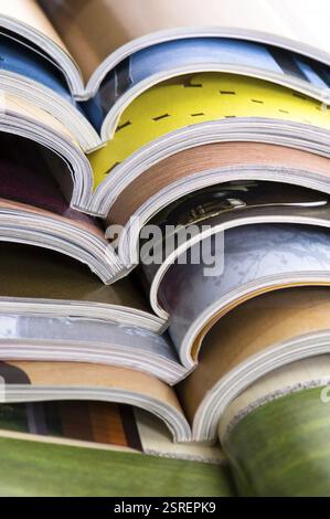 Stack of open magazines Stock Photo - Alamy