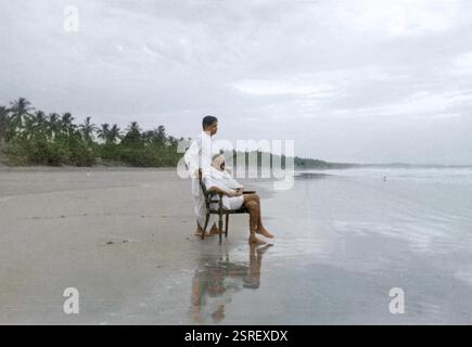 Mahatma Gandhi sitting on chair and Devdas Gandhi on Juhu Beach, Bombay ...
