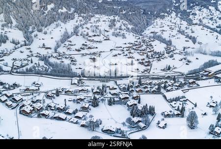 Panorama view of Grindelwald villages with wooden chalets covered with ...