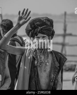 Traditional Hindu ascetics covered in ashes stand together during the ...
