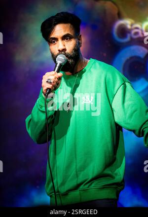 indian comedian performing stand up comedy and telling jokes in ...