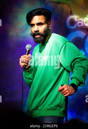 indian comedian performing stand up comedy and telling jokes in ...