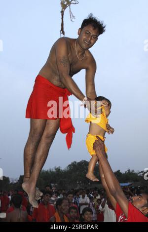 Hindu devotees hanging on ropes perform Chadak rituals during the ...