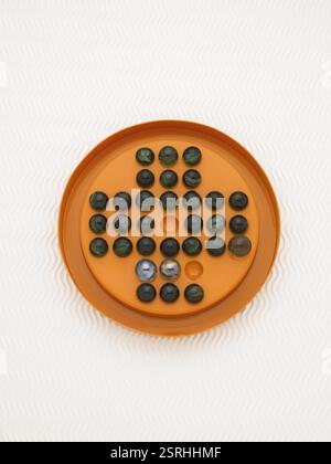 Marble solitaire game India Stock Photo - Alamy