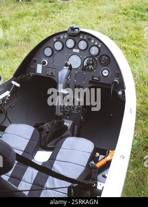 Close-up of a glider cockpit showing flight instruments, control stick ...