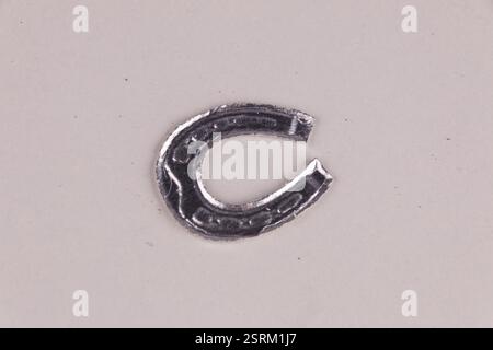 View of a three-dimensional horseshoe with a silver metallic appearance ...