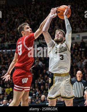 Wisconsin guard Jack Janicki (33) steals the ball from Minnesota ...