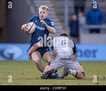 Sale Sharks' Arron Reed is tackled by Northampton Saints' Tommy Freeman ...