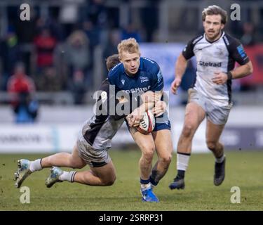 Sale Sharks' Arron Reed is tackled by Northampton Saints' Tommy Freeman ...