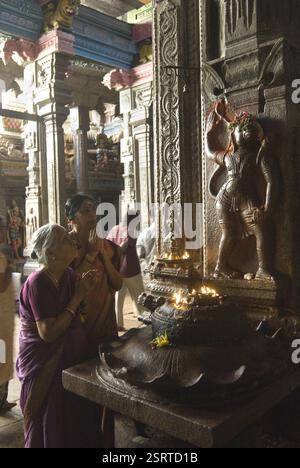 9 devout Hindu women in colorful saris pose for a group photo before ...