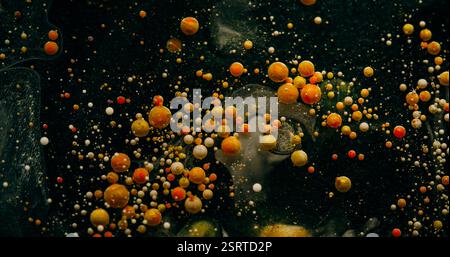 Paint blob. Bubble burst. Colorful drops particles spilling in water ...