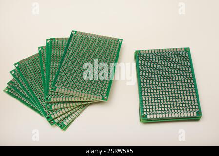 A green breadboard for electronics. The printed circuit board Stock ...