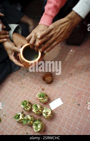 Devotees worship copper cans holy water can close-ups closeups Color ...