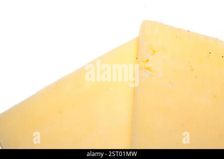 Close up of chedder cheese slices on a white background Stock Photo - Alamy