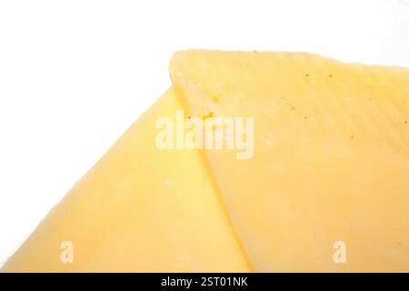 Close up of chedder cheese slices on a white background Stock Photo - Alamy