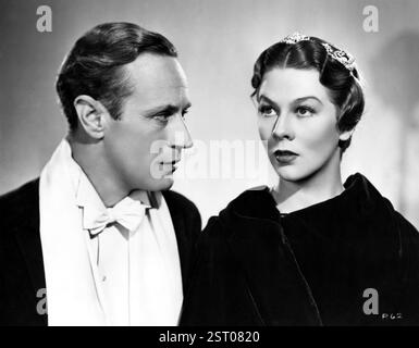 LESLIE HOWARD as Henry Higgins and WENDY HILLER as Eliza Doolittle in ...