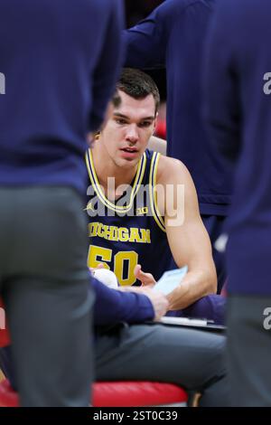 Michigan center Vladislav Goldin (50) lays in a shot against Michigan ...