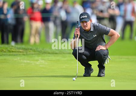 Maverick McNealy lines up a putt on the 16th green during the third ...