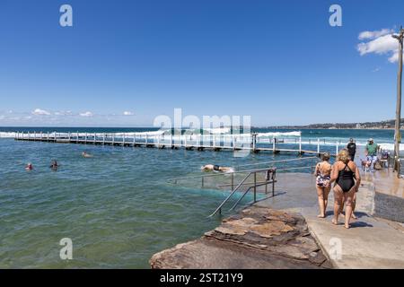 Narrabeen beach ocean rockpool , women and other people swimming in ...